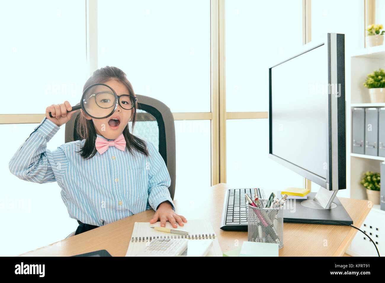 cute beautiful little girl dressed up as business worker sitting in ...
