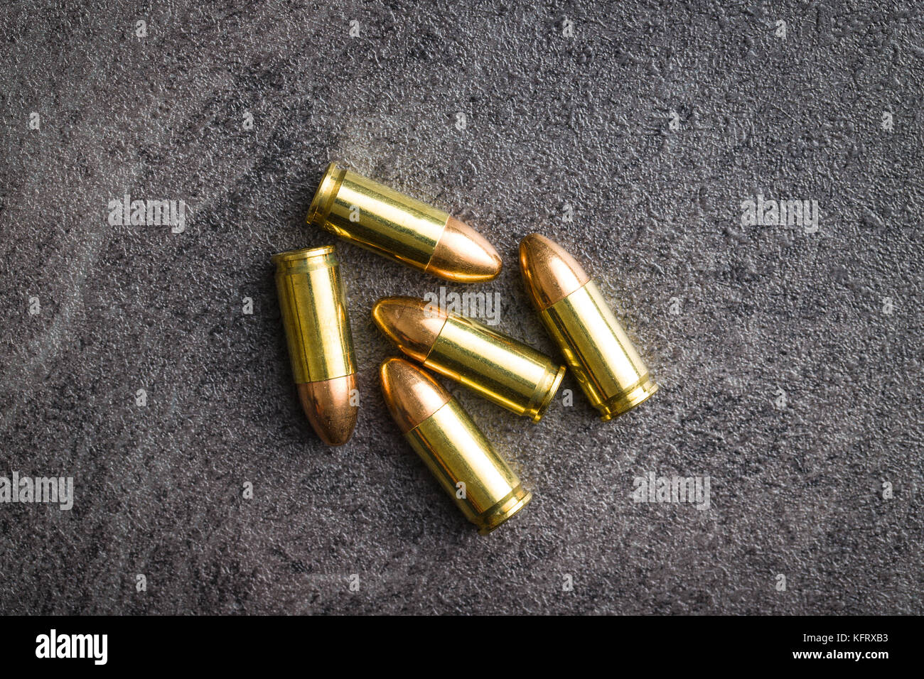 9mm pistol bullets on black table Stock Photo - Alamy