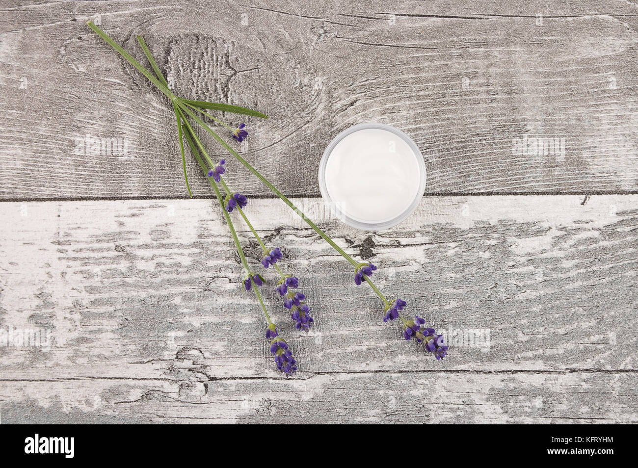 Open moisturizer and lavender on weathered wood Stock Photo - Alamy
