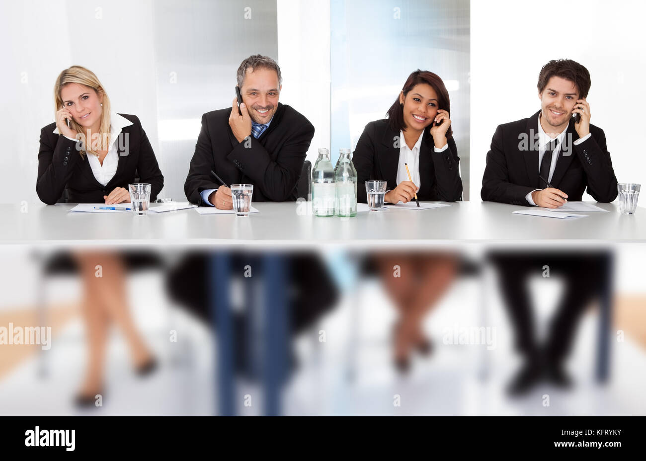 Group of business people talking on the phones at the meeting Stock ...