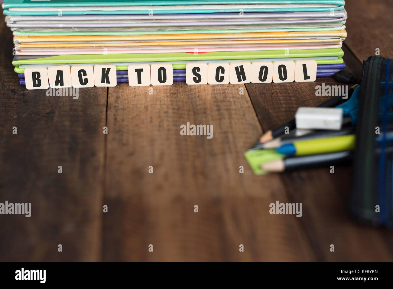 back to school concept - book,pen,ruler,eraser and pencil sharpener on ...