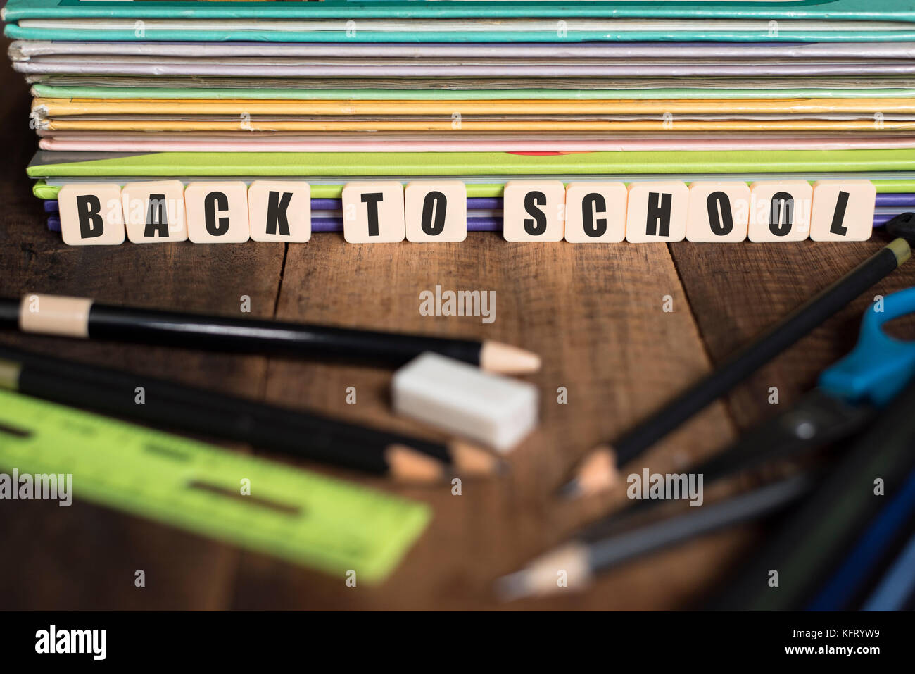 back to school concept - book,pen,ruler,eraser and pencil sharpener on ...