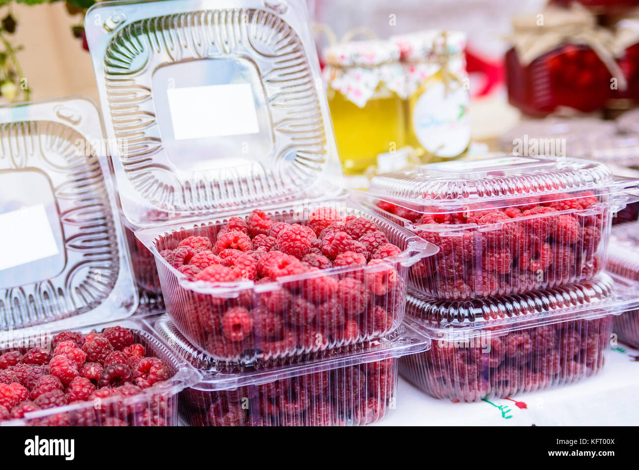Raspberries in plastic box in supermarket Stock Photo - Alamy