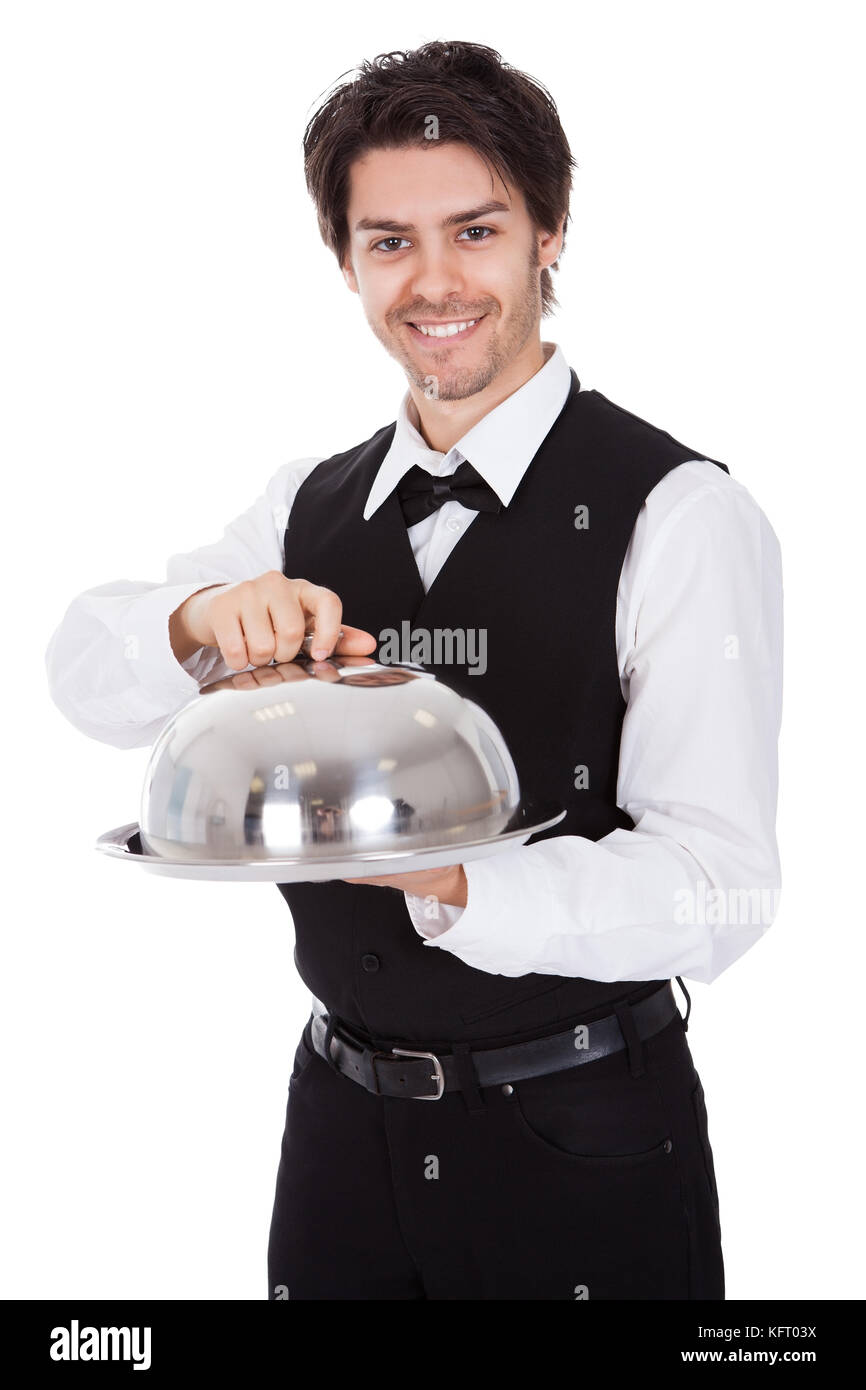 Portrait of a butler with bow tie and tray. Isolated on white Stock ...