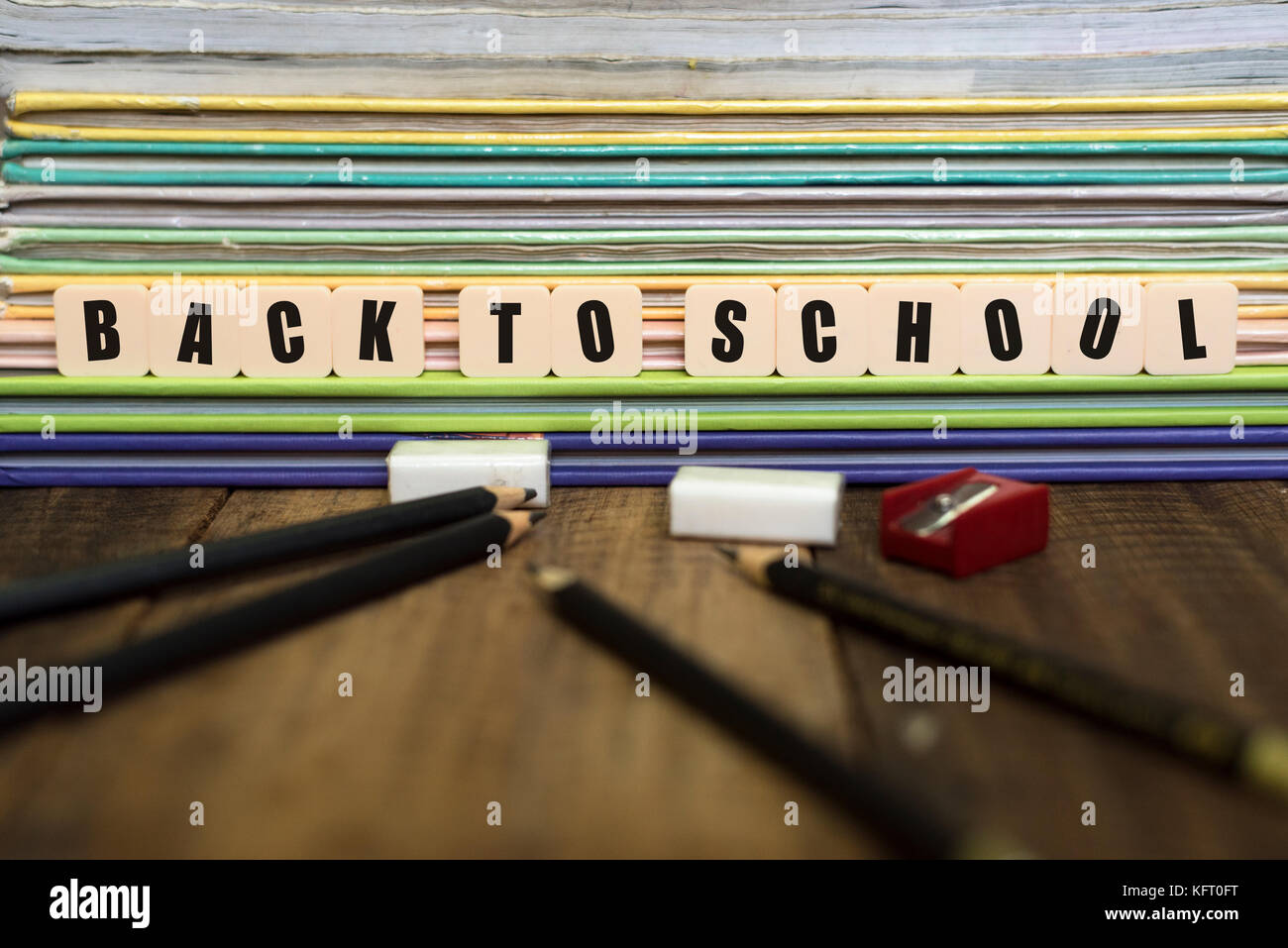 back to school concept - book,pen,ruler,eraser and pencil sharpener on ...