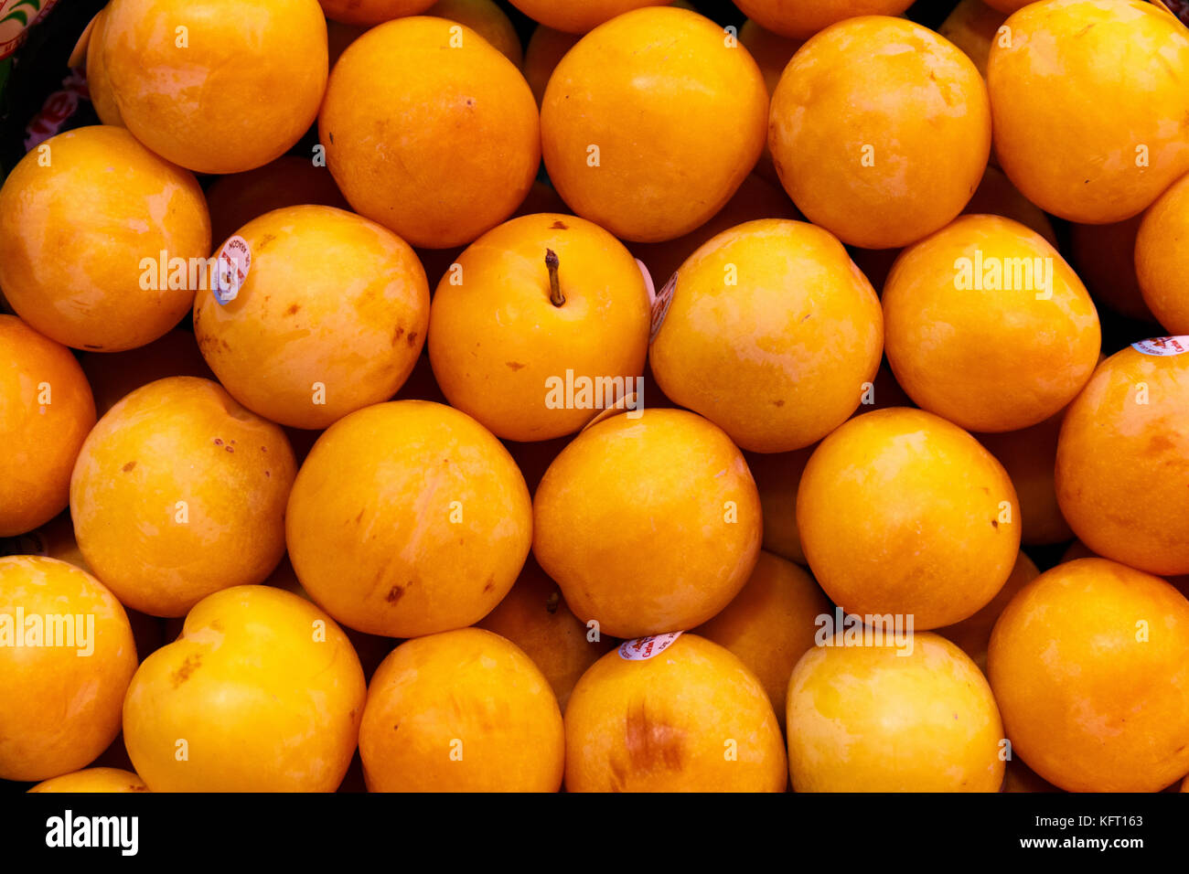 yellow plums in a market in Madrid Stock Photo - Alamy