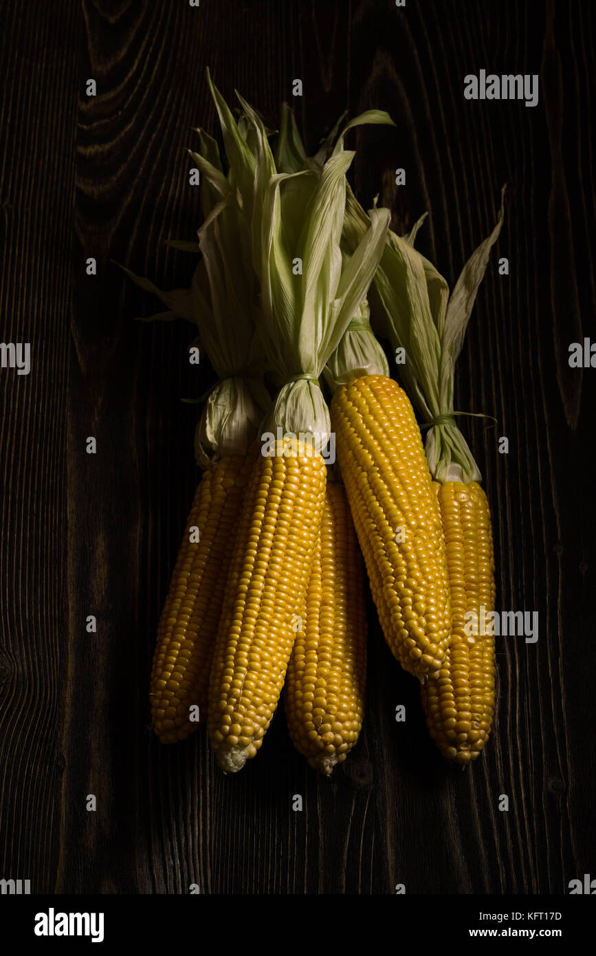 Corn cobs on the old rough wood Stock Photo - Alamy