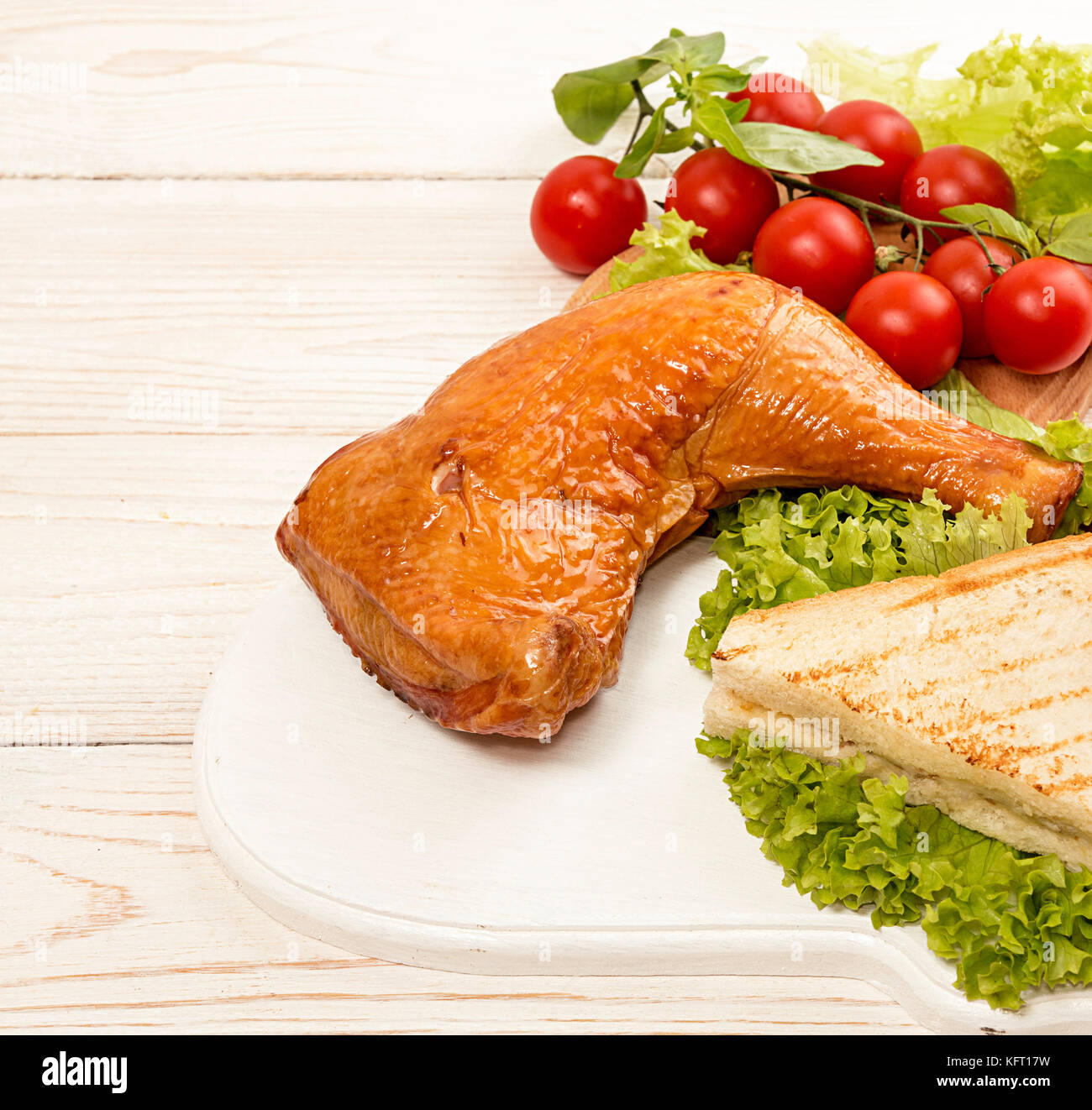 Smoked chicken leg. Sandwich with smoked grill chicken garnish with ...