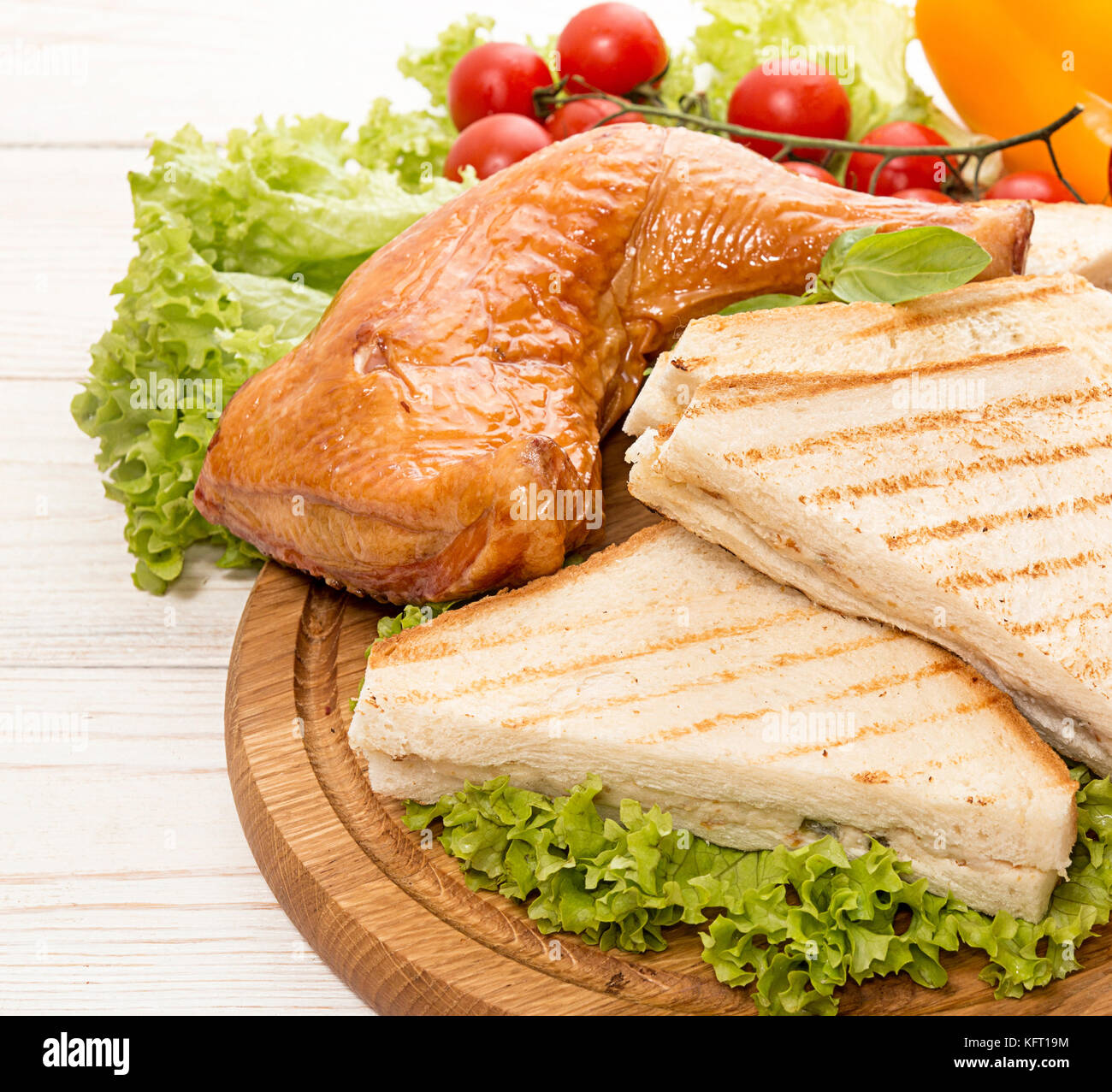 Smoked chicken leg. Sandwich with smoked grill chicken garnish with ...