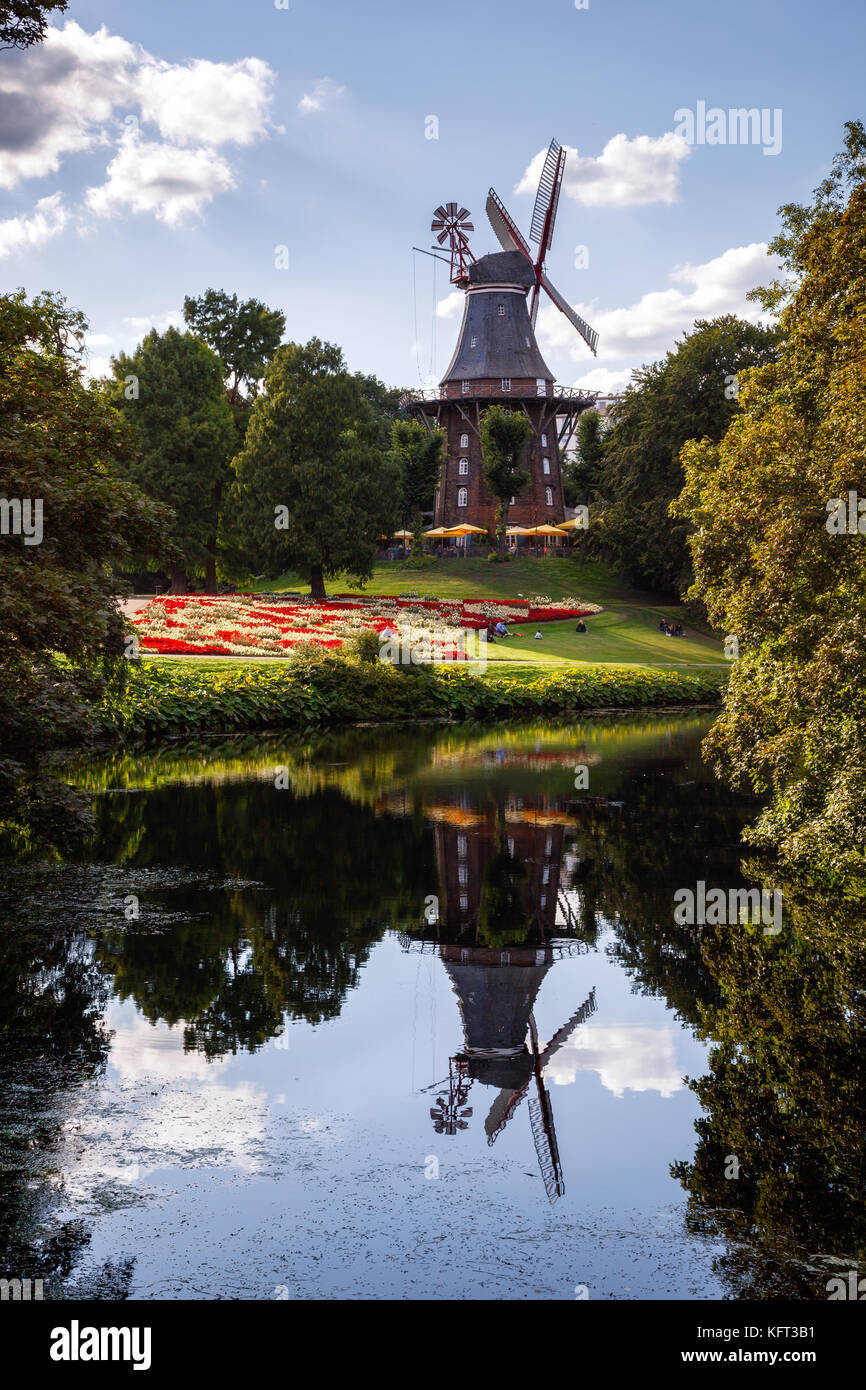 Popular city park Wallanlagen with Am Wall Windmill and its reflection ...