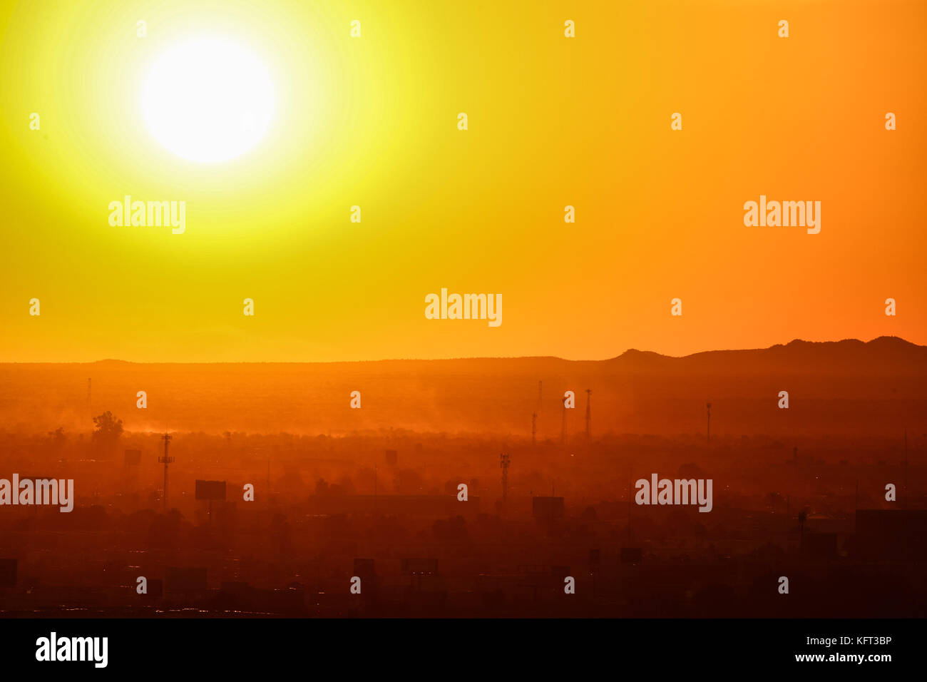 Sun and sunspots seen at sunset over the city of Hermosillo Sonora, one ...