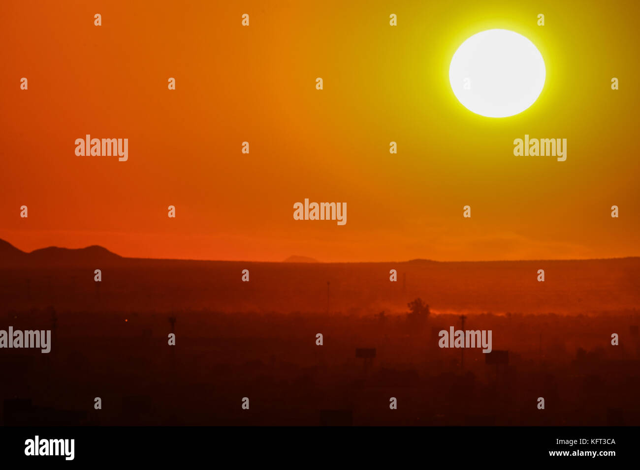 Sun and sunspots seen at sunset over the city of Hermosillo Sonora, one ...