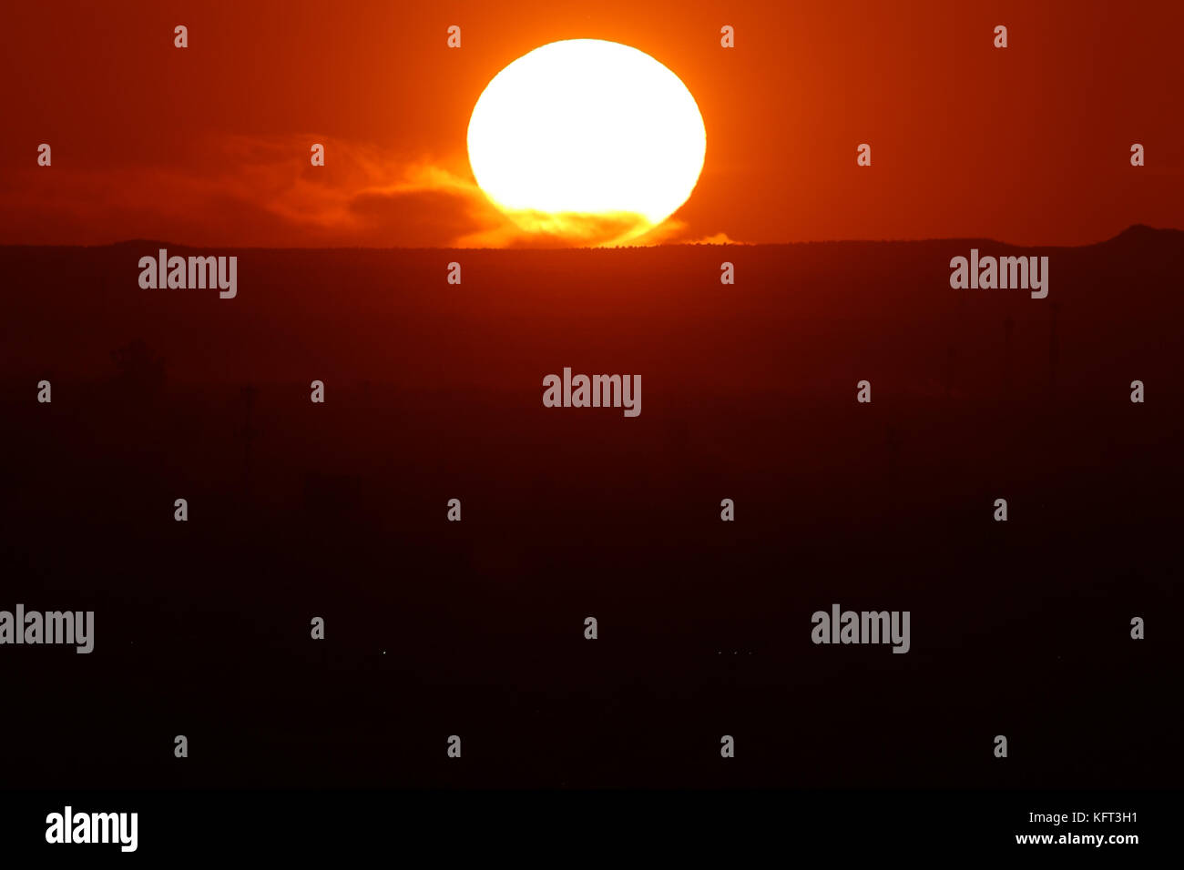 Sun and sunspots seen at sunset over the city of Hermosillo Sonora, one ...