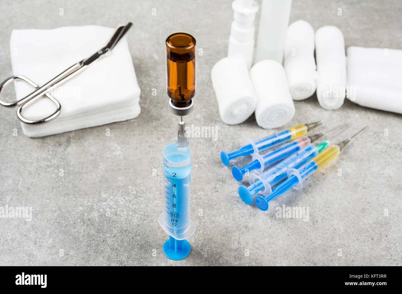 Nurse filling up an injection for the patients with other medical tools ...