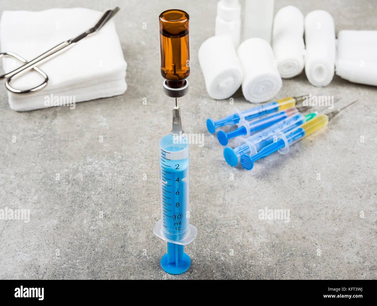 Nurse filling up an injection for the patients with other medical tools ...