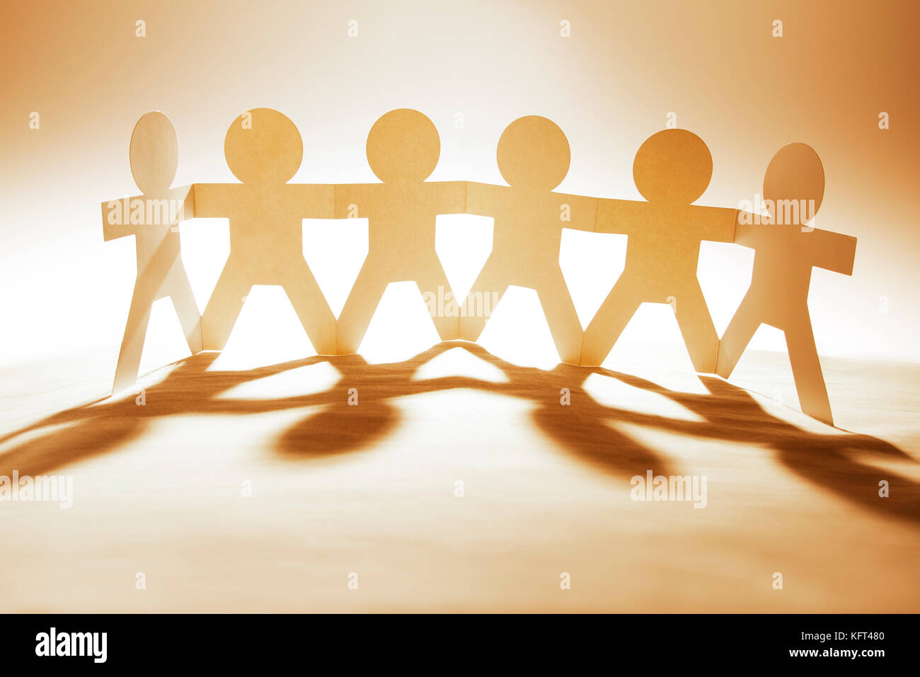 Team of paper chain people Stock Photo - Alamy