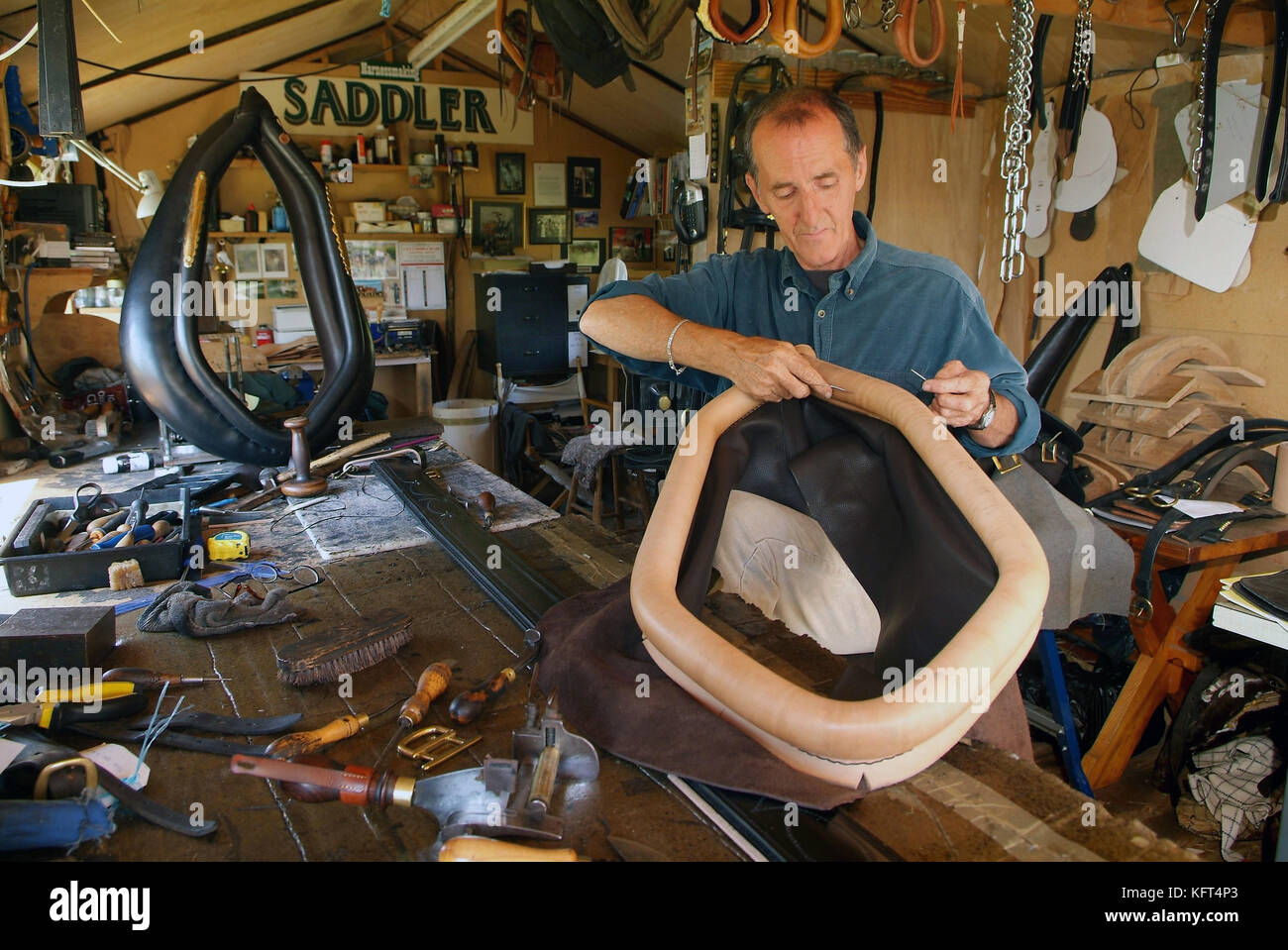 Terry Davis, maker of horse collars, saddles and harness at his ...