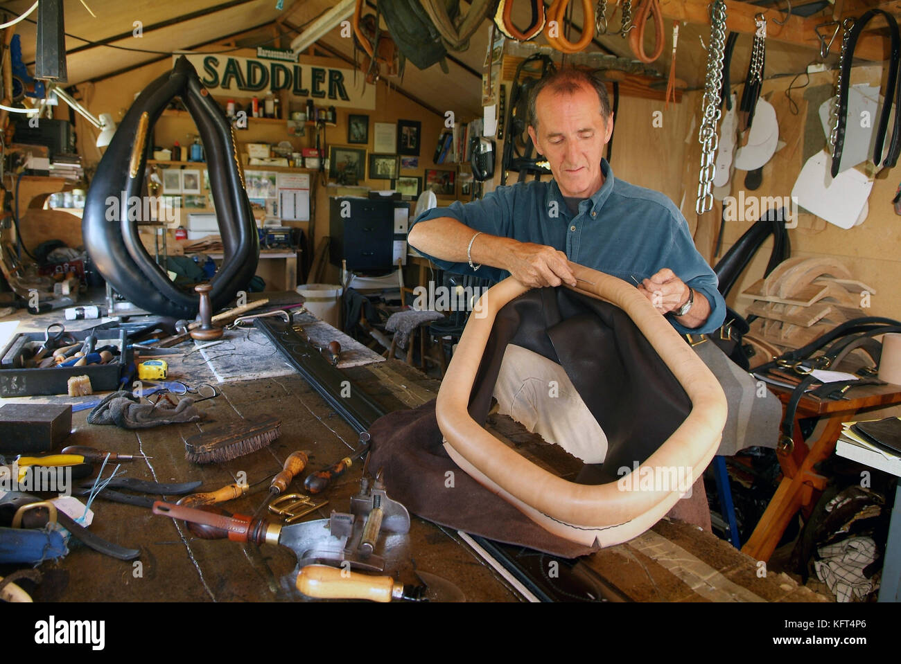 Terry Davis, maker of horse collars, saddles and harness at his ...