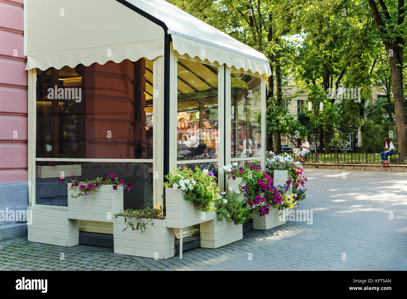 Flowers in the boxes. The summer terrace of the restaurant is decorated ...