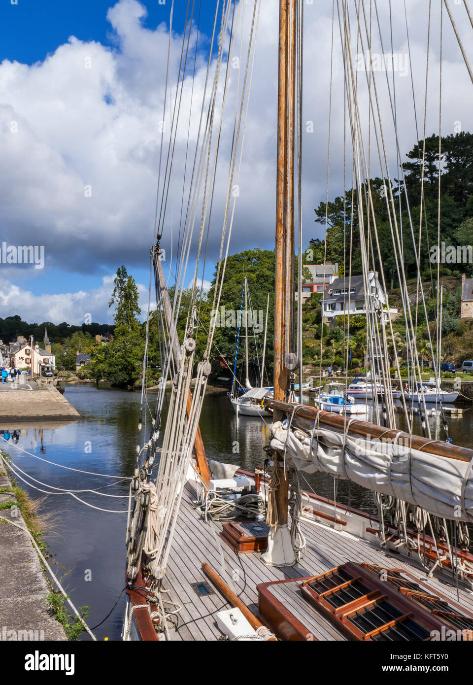 Pont-Aven with traditional historic sailing boat riggings and houses on ...