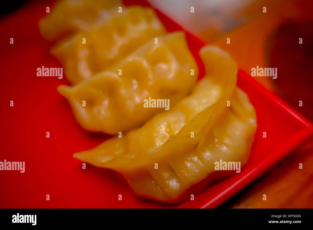 Close up of steamed Momo served in a red plate. A popular Nepalese food ...