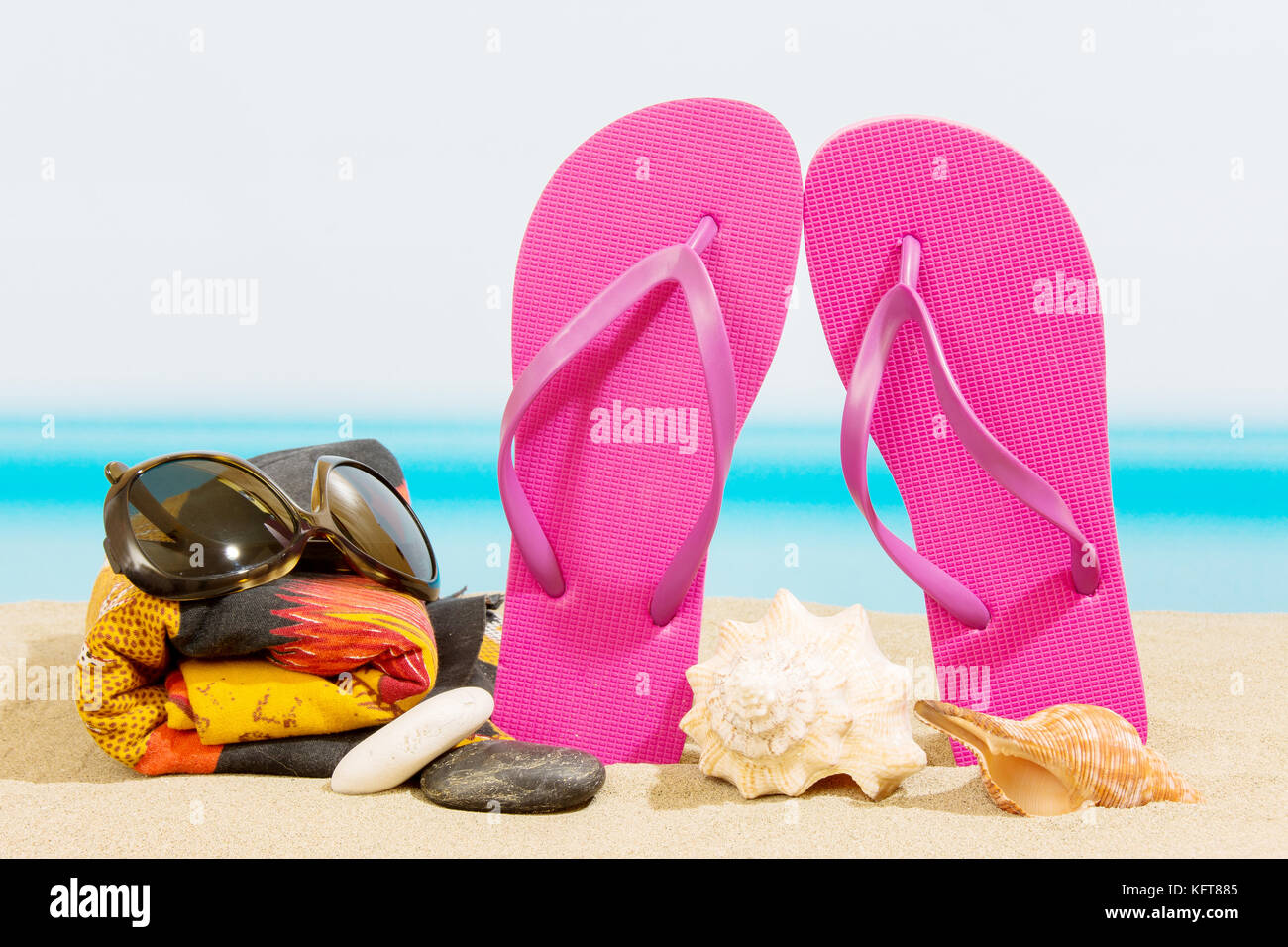 Flip flops on the beach Stock Photo - Alamy