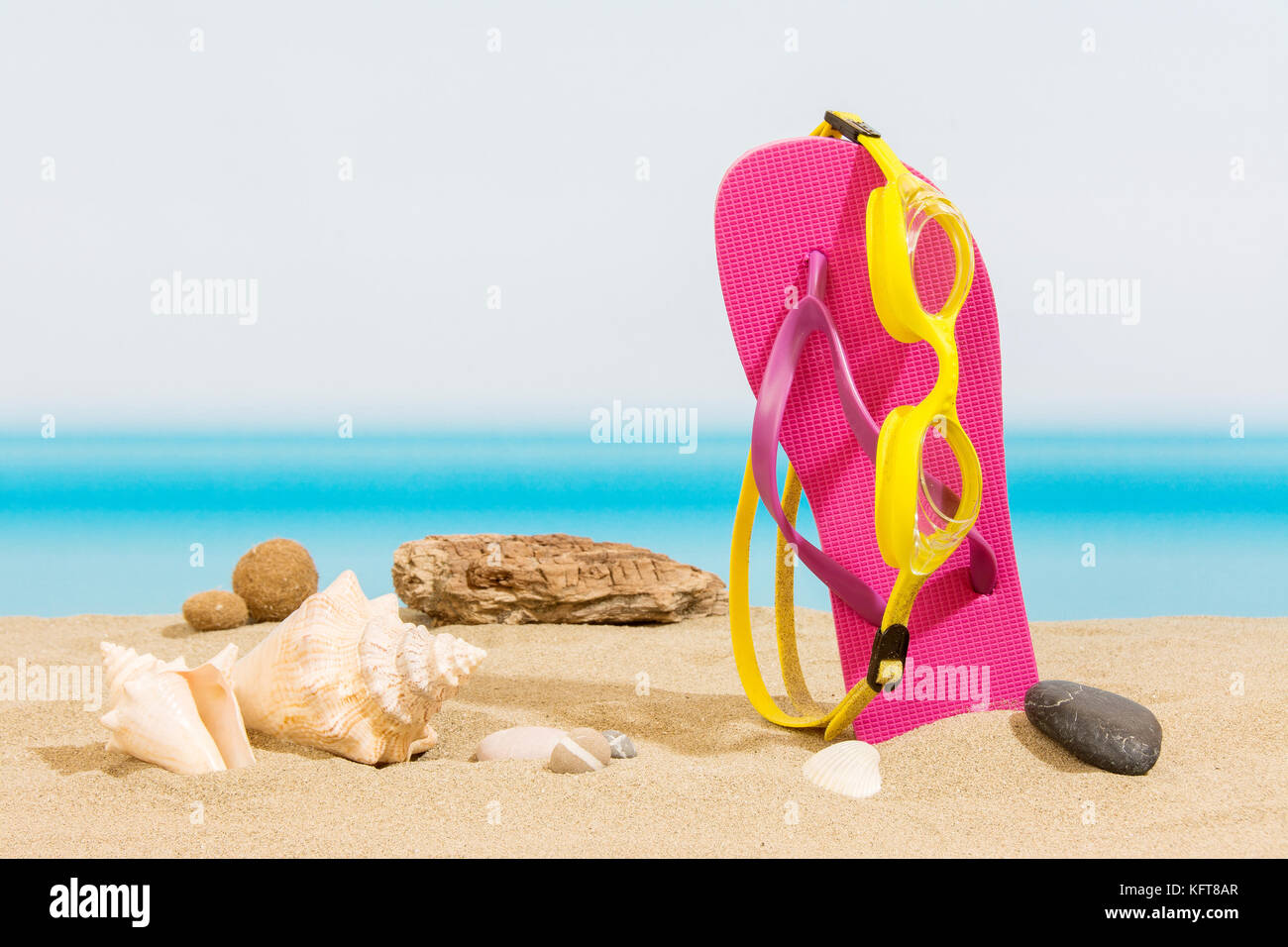 Flip flops on the beach Stock Photo - Alamy