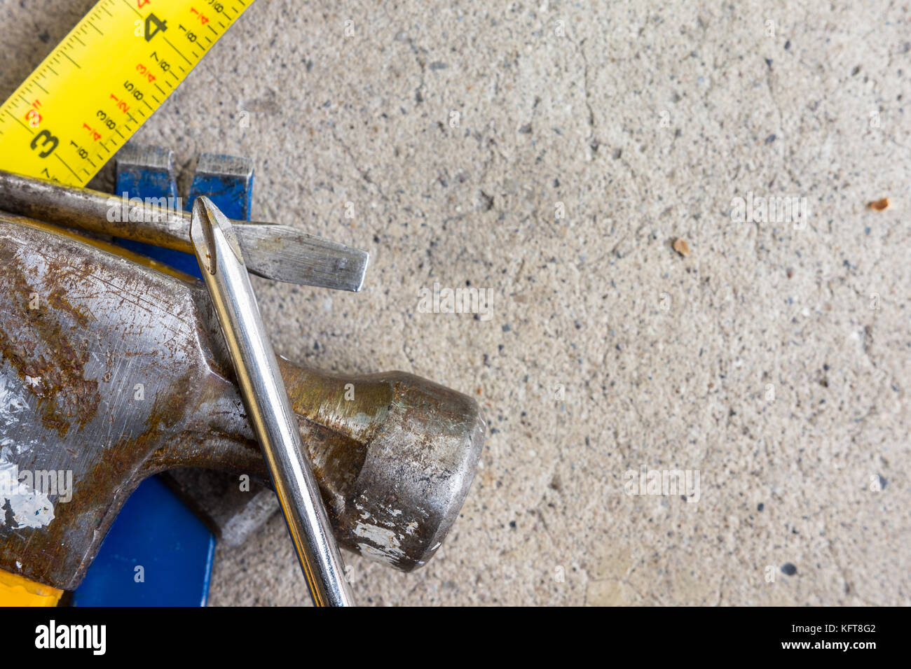 Various tools layed out on concrete background Stock Photo - Alamy