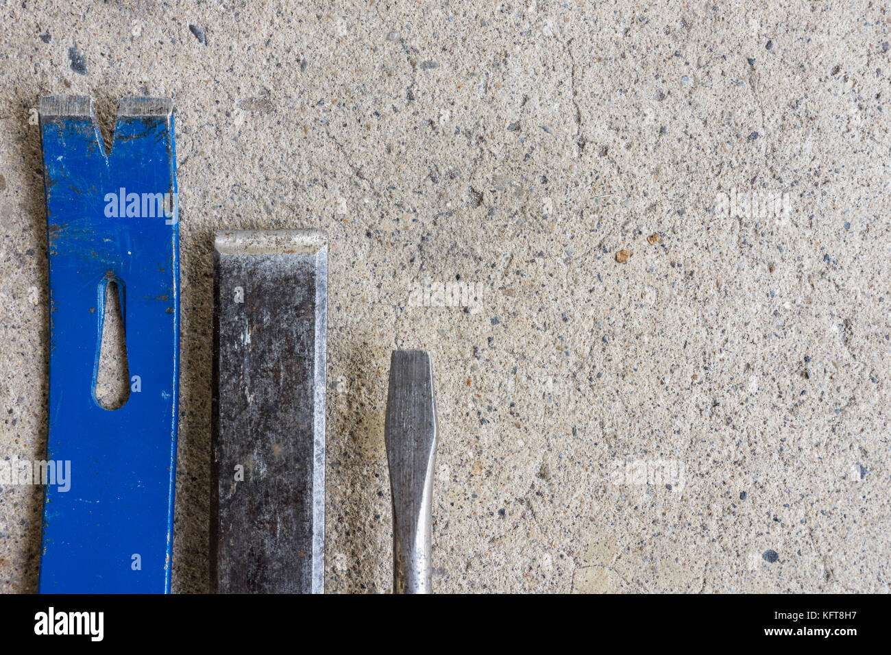 Various tools layed out on concrete background Stock Photo - Alamy