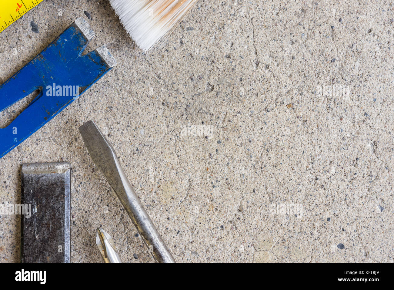 Various tools layed out on concrete background Stock Photo - Alamy