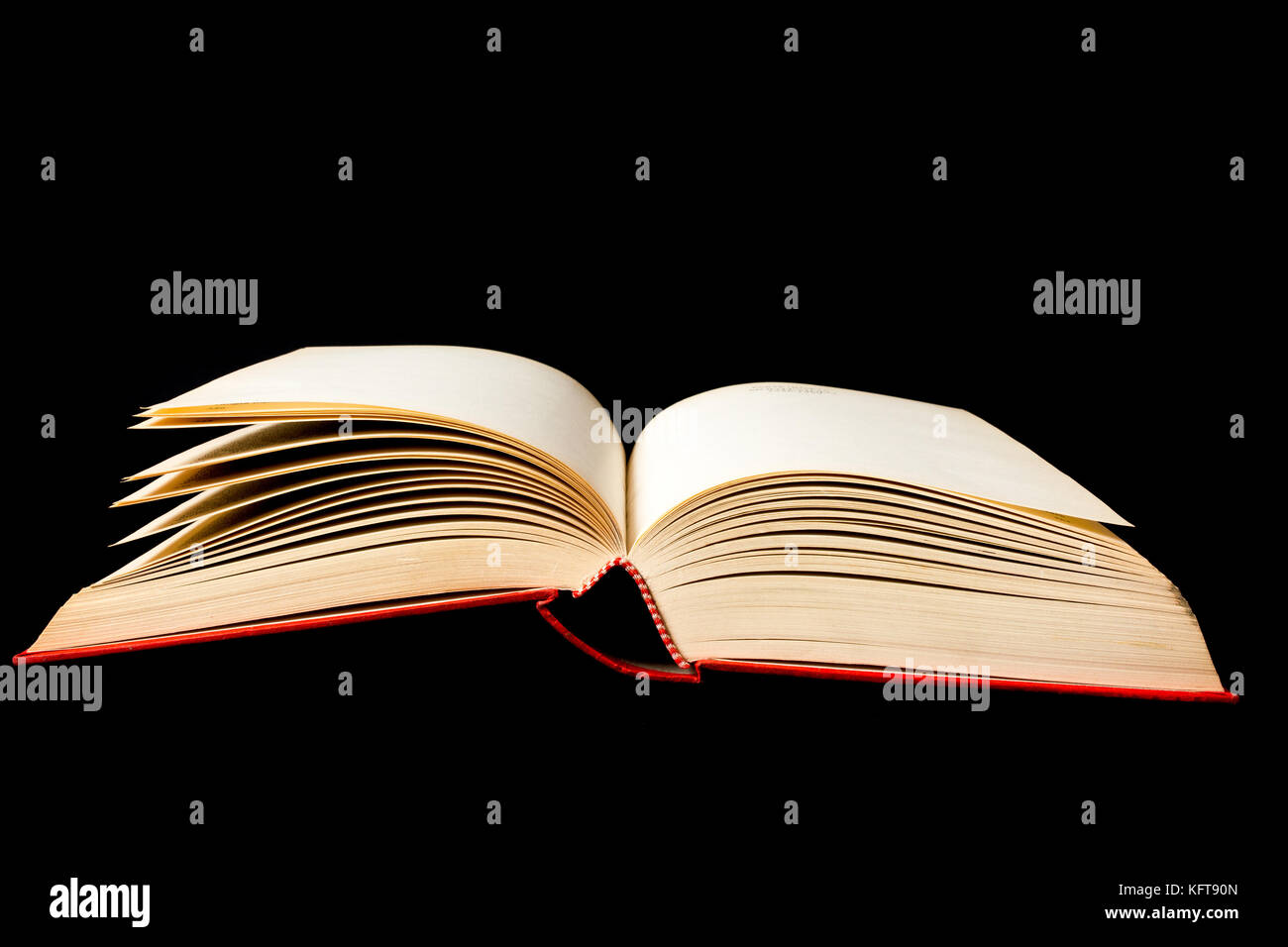 Vintage old open book on black background Stock Photo - Alamy