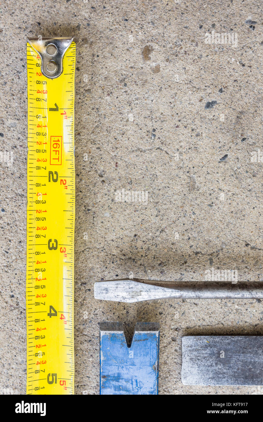 Various tools layed out on concrete background Stock Photo - Alamy
