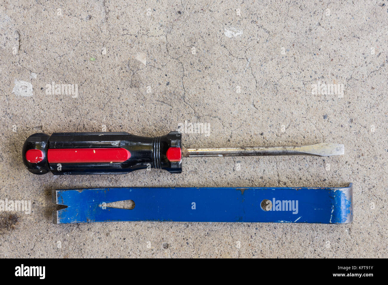 Various tools layed out on concrete background Stock Photo - Alamy
