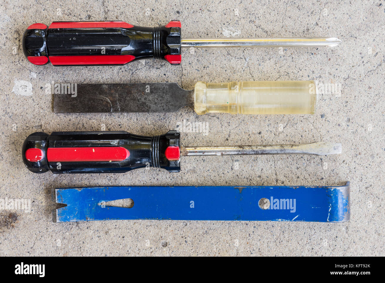 Various tools layed out on concrete background Stock Photo - Alamy