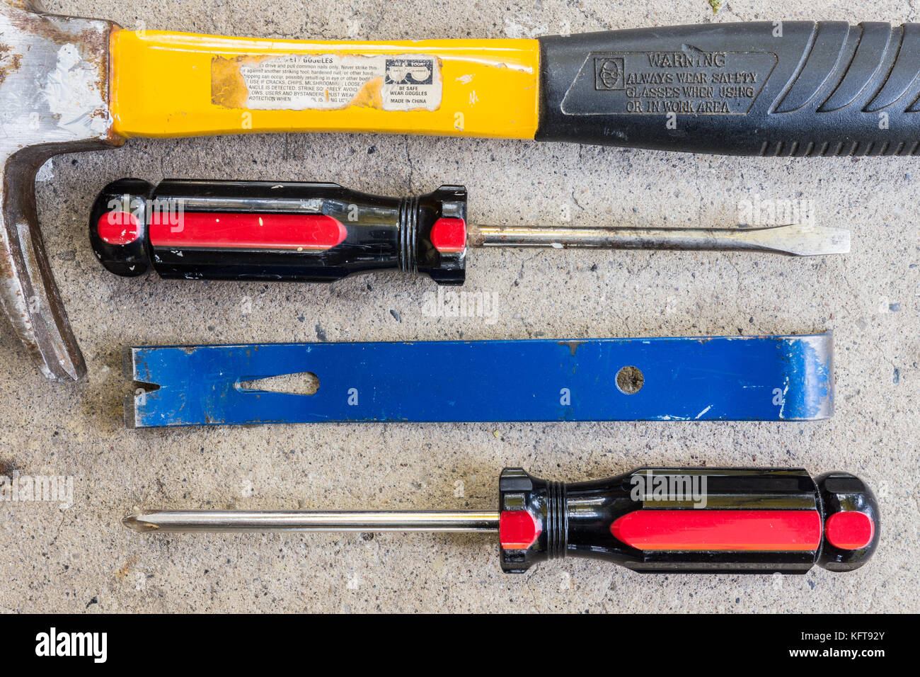 Various tools layed out on concrete background Stock Photo - Alamy