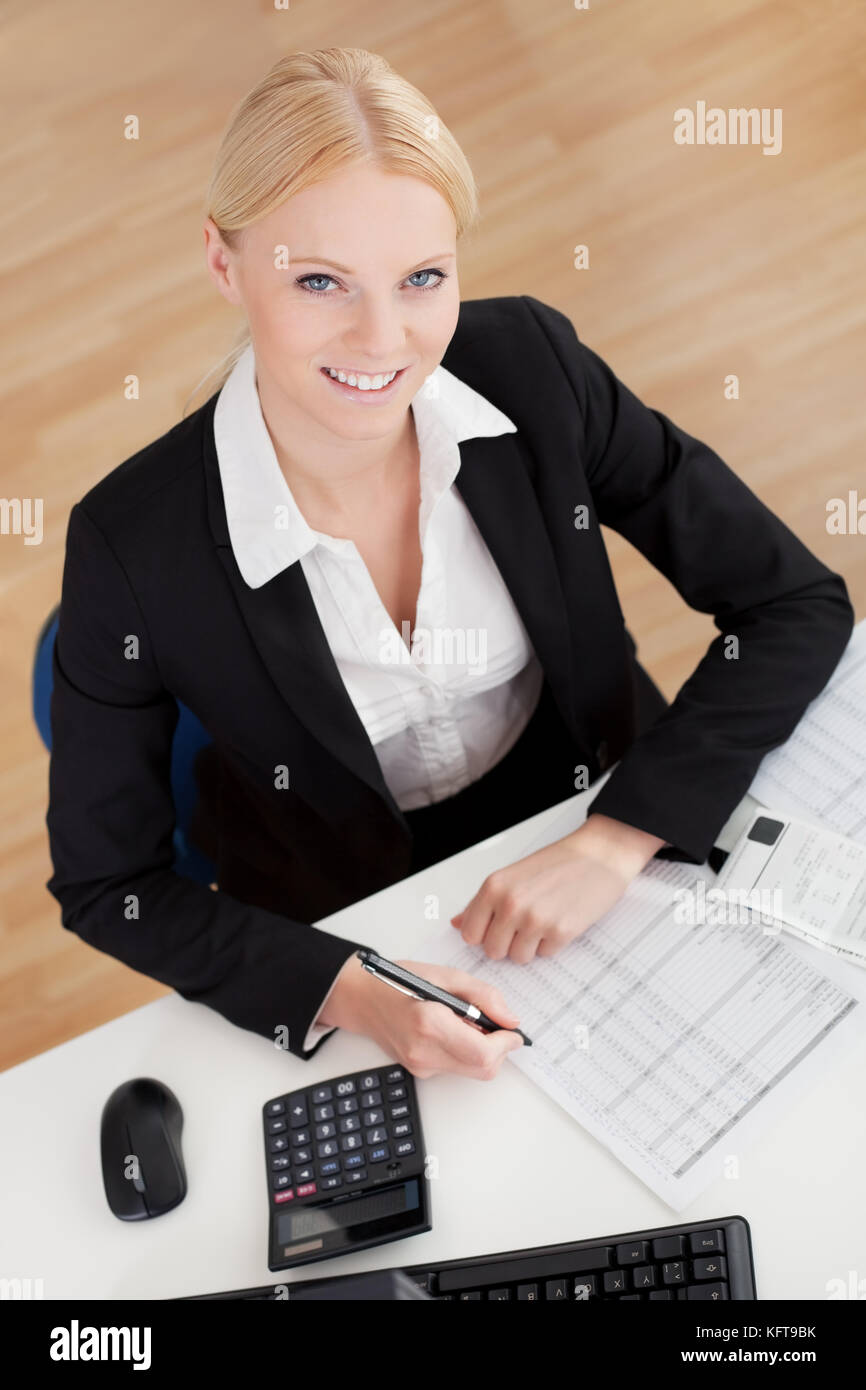 Cheerful accountant businesswoman working in the office Stock Photo - Alamy