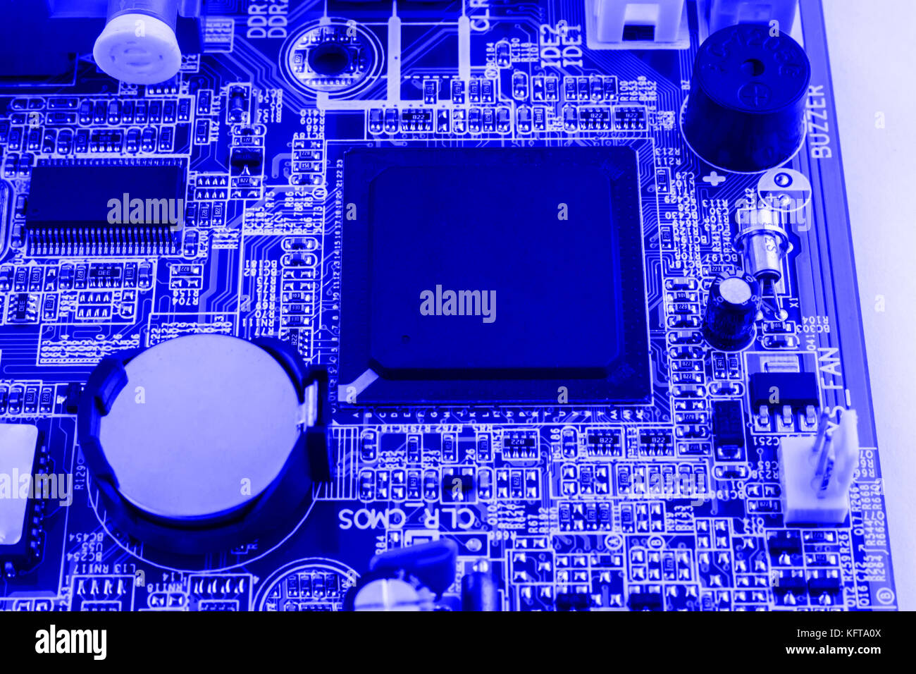 Integrated semiconductor microchip on blue circuit board representative ...