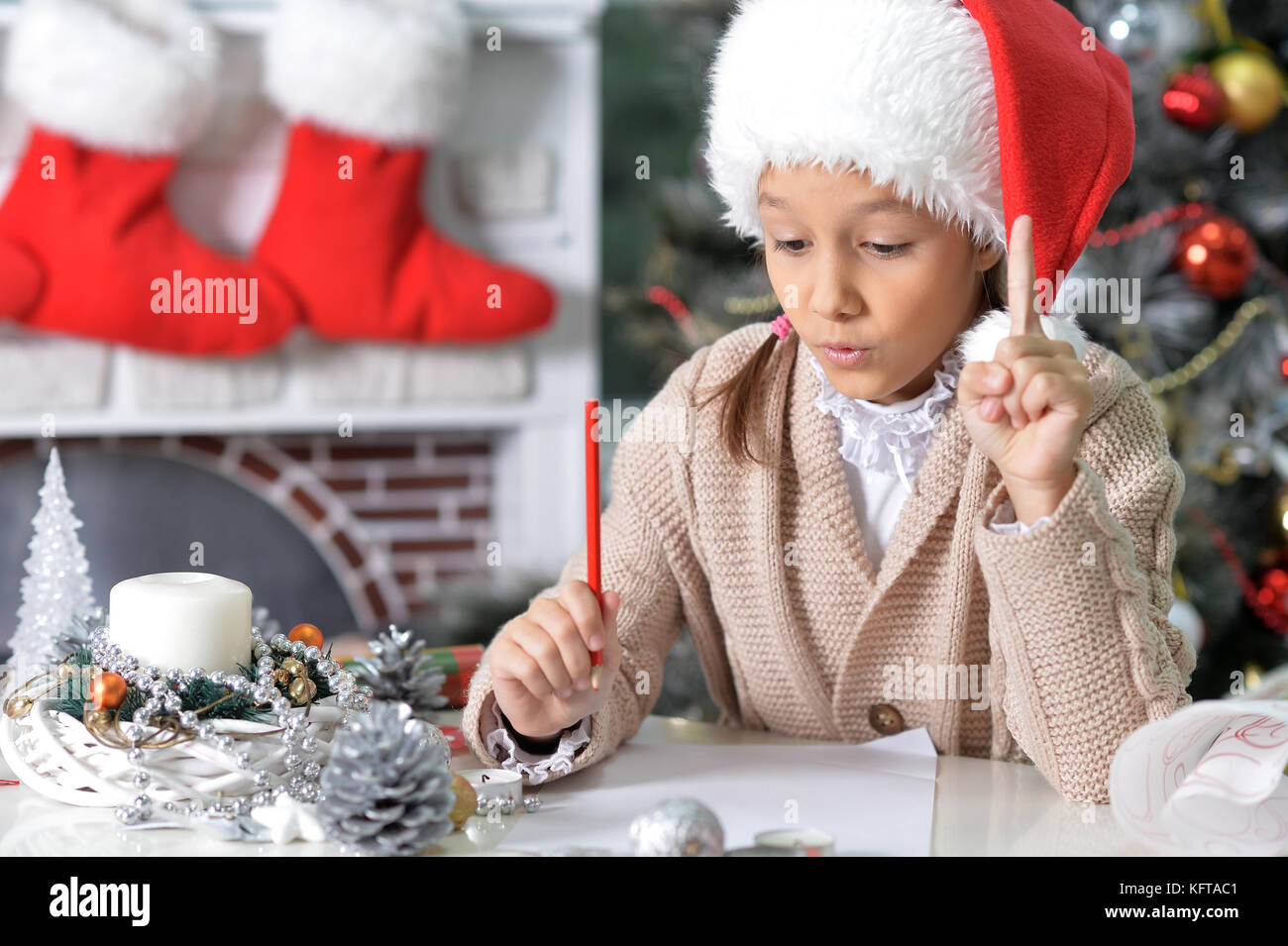 Portrait of smiling little girl writing letter Stock Photo - Alamy