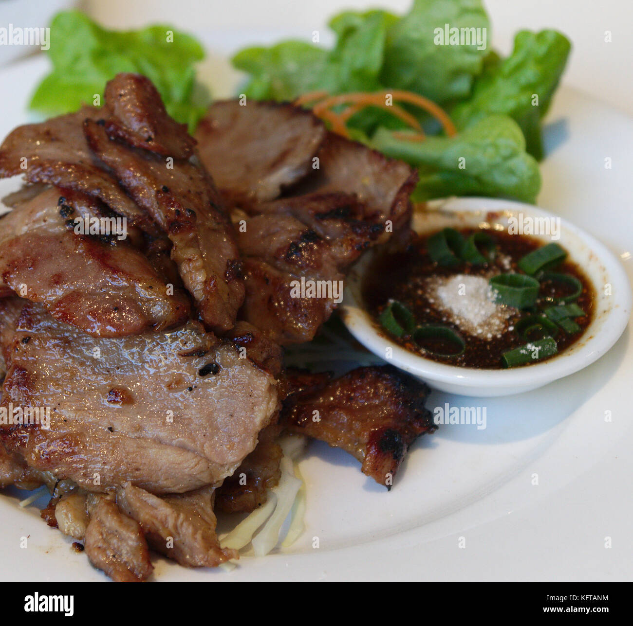 grilled pork with smoked chili & tamarind sauce Stock Photo - Alamy