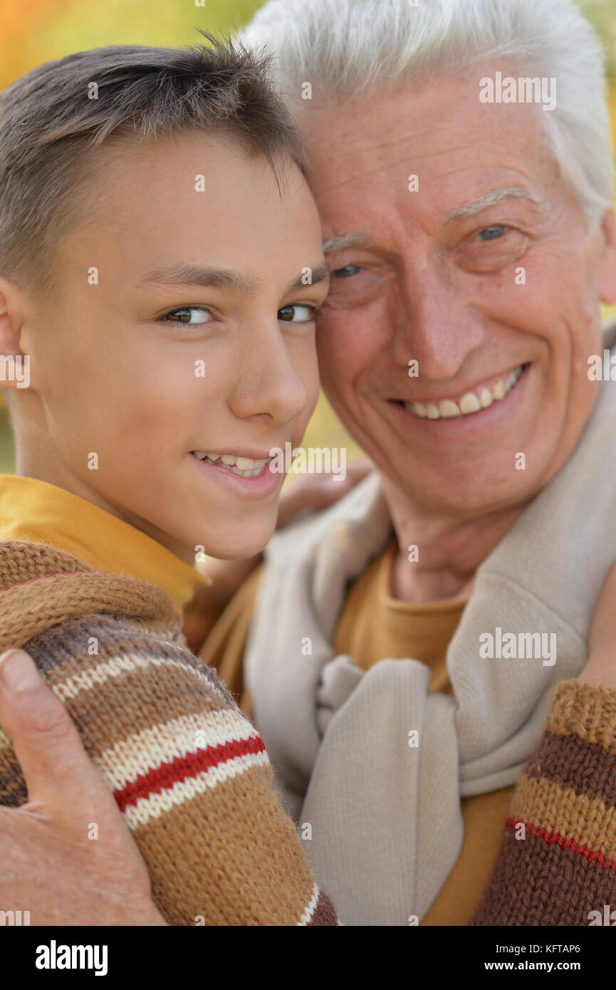 grandfather and grandson hugging in park Stock Photo - Alamy