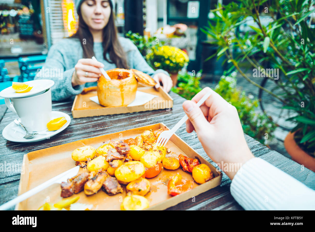 couple eating in cafe outside Stock Photo - Alamy