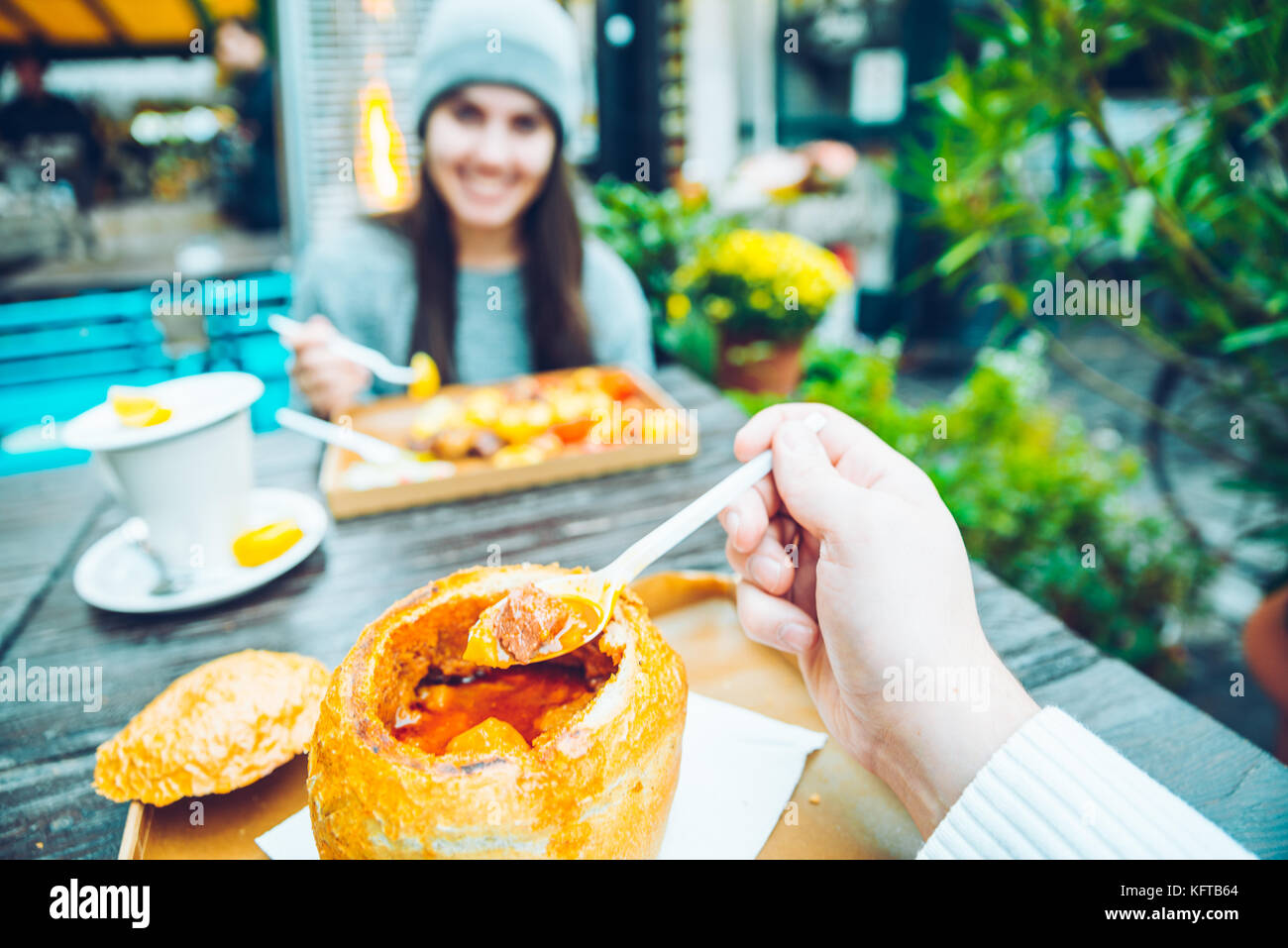 couple eating in cafe outside Stock Photo - Alamy