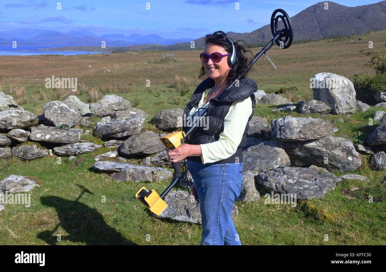Mature female metall detecting, Ireland - John Gollop Stock Photo - Alamy