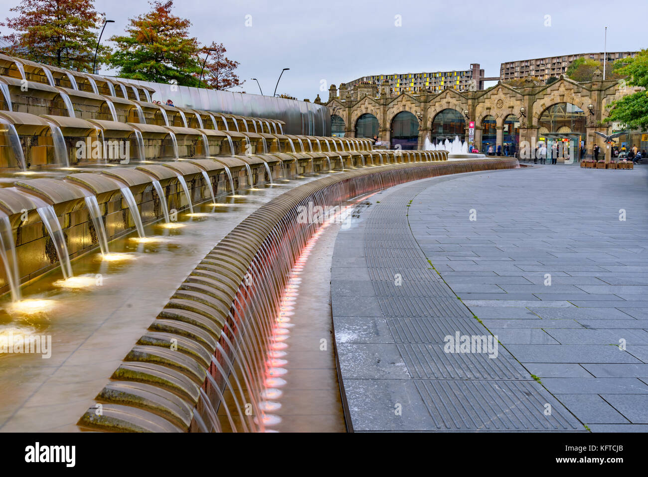 The stone façade of Sheffield station and the water cascading from ...
