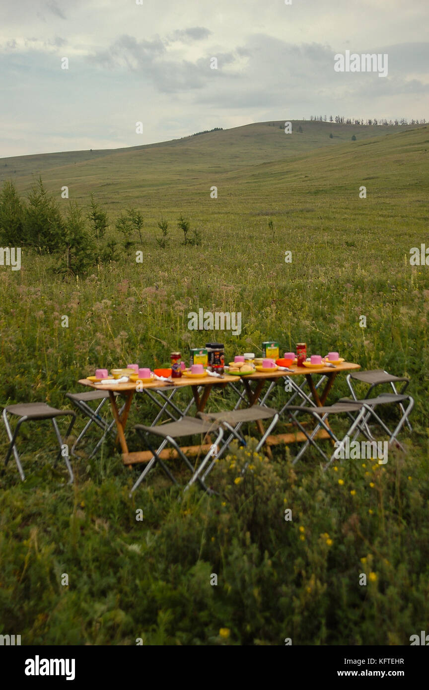 Table with breakfirst in mongolian grassland natural landscape Mongolia ...
