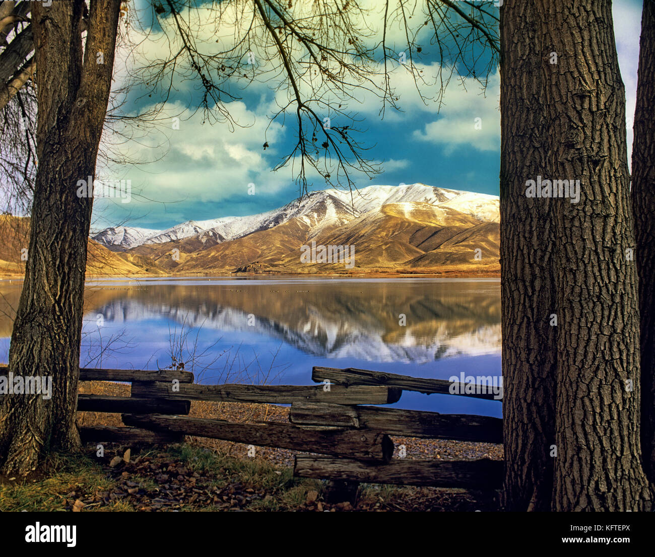 Fence and reflection in Snake River at Farewell Bend State Park, Oregon ...