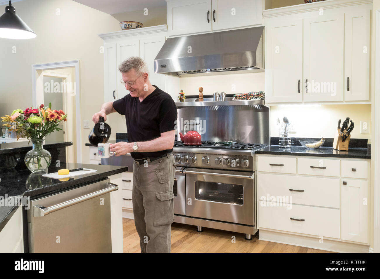 Senior Man in Showcase Kitchen, USA Stock Photo - Alamy