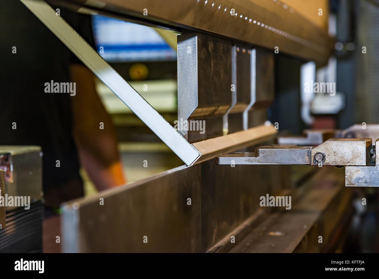 worker operating metal press machine at workshop Stock Photo - Alamy