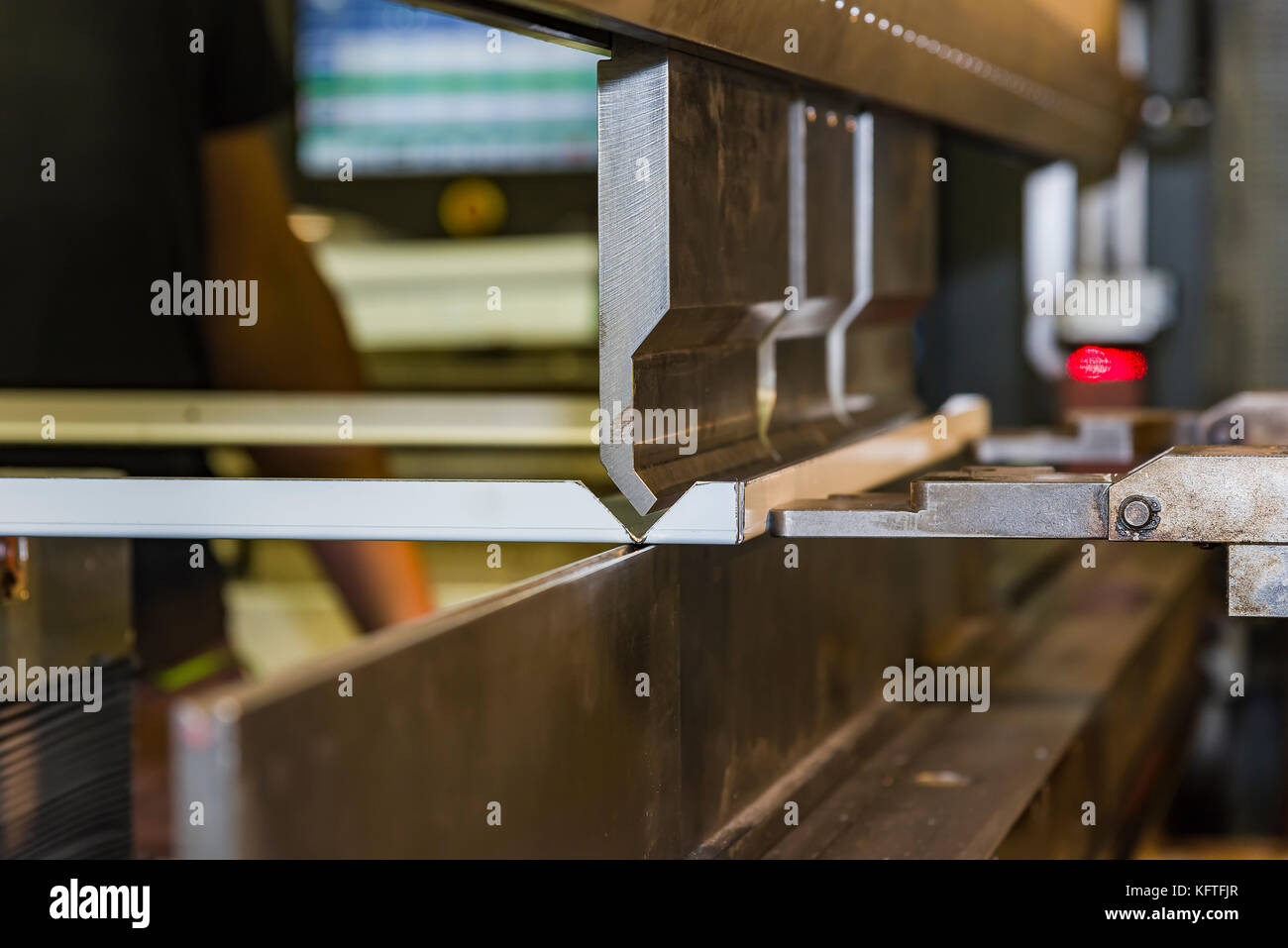 worker operating metal press machine at workshop Stock Photo - Alamy