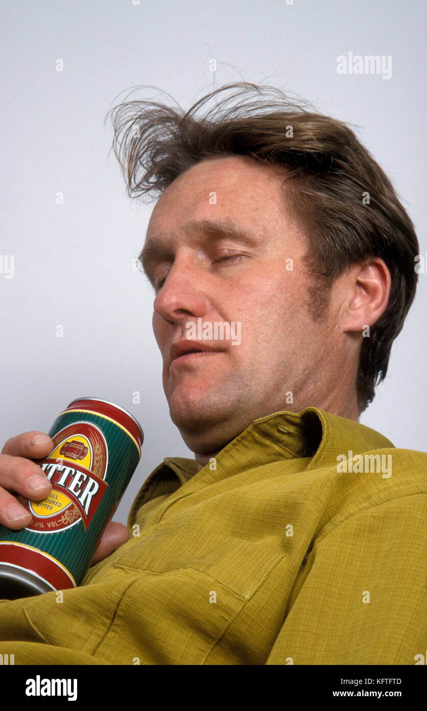 drunken man with can of bitter Stock Photo - Alamy